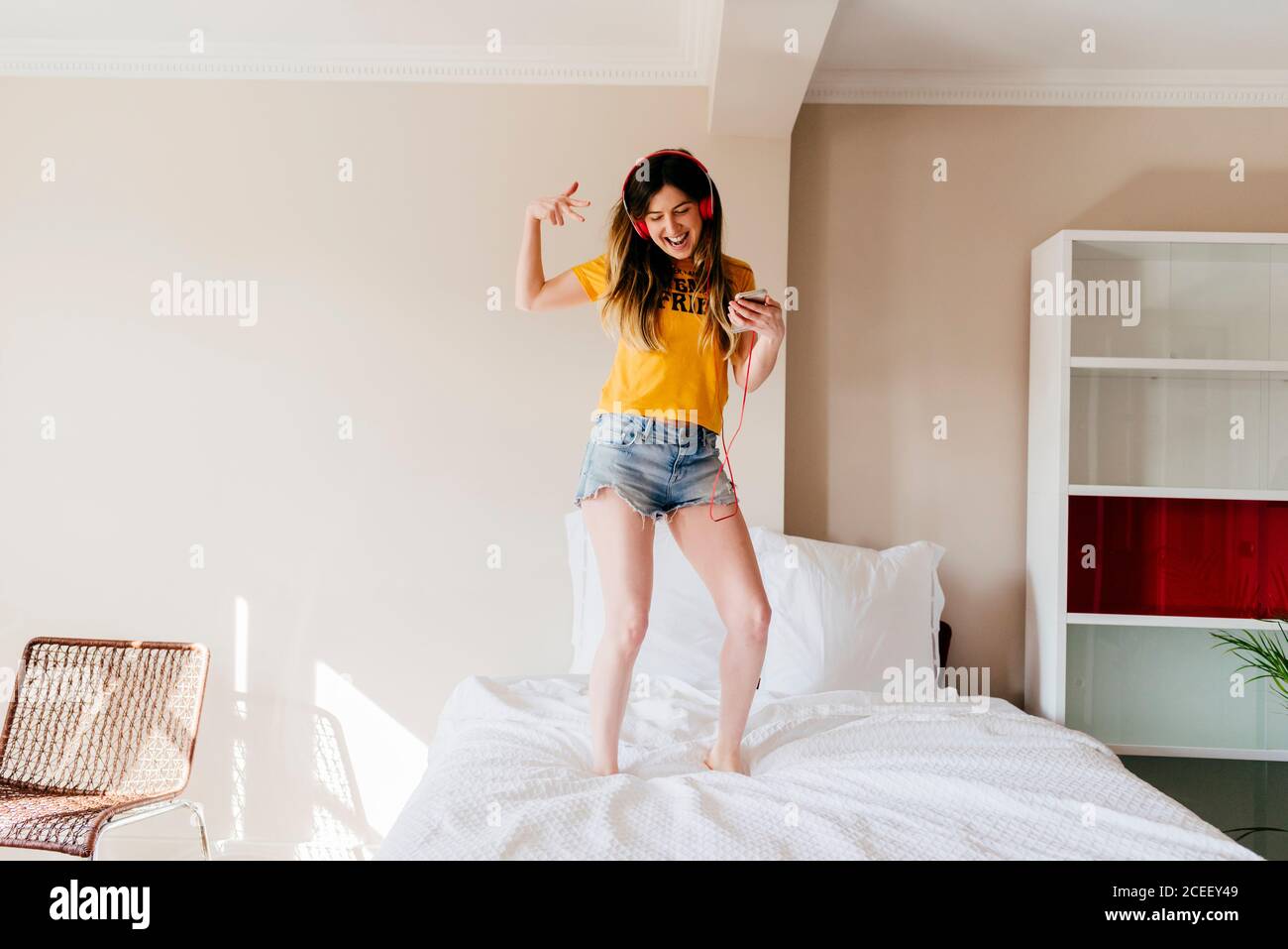 Dancing on bed hi-res stock photography and images - Alamy