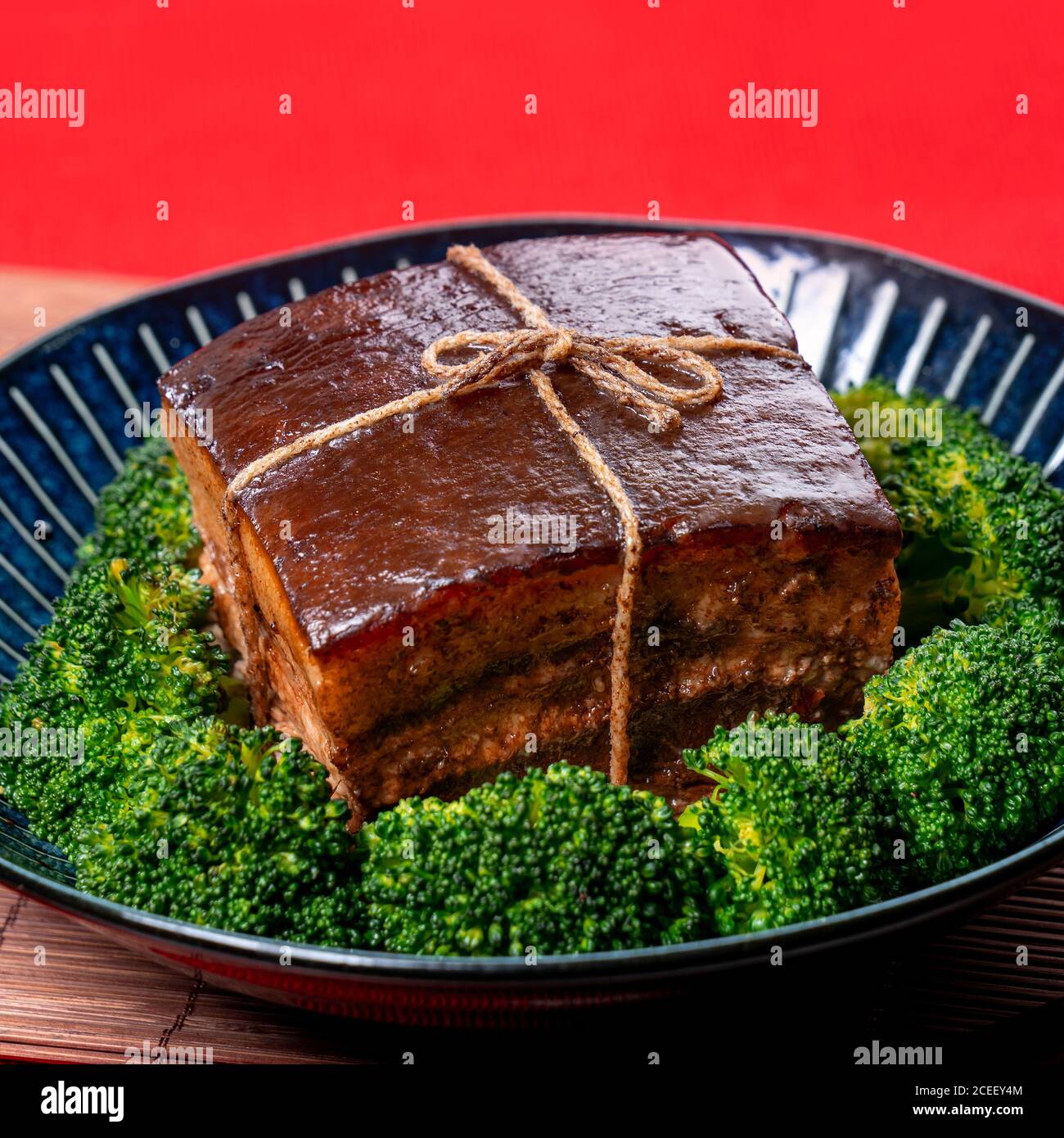 Dong Po Rou (Dongpo pork meat) in a beautiful blue plate with green ...