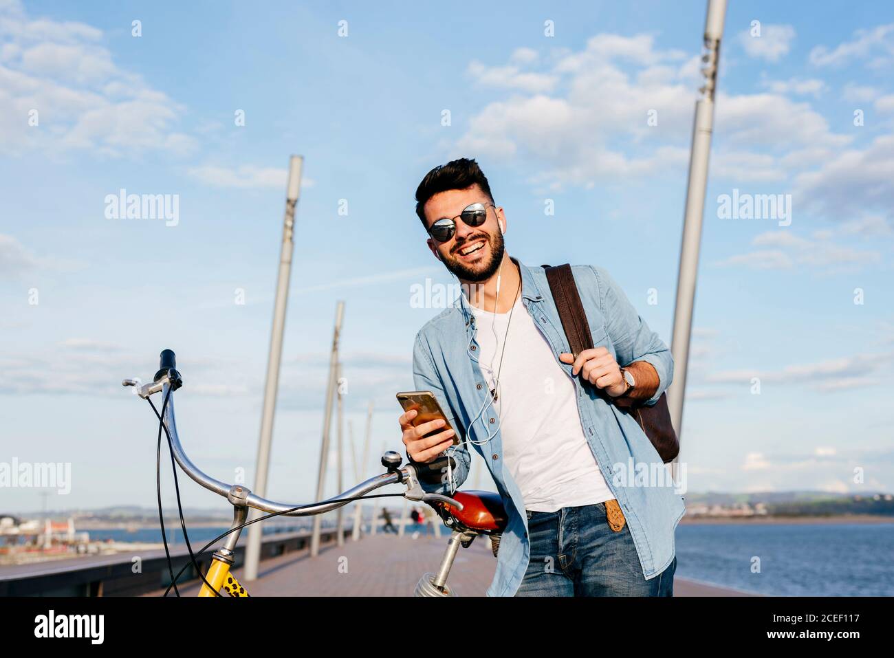 Man standing pose with cycle hi-res stock photography and images - Alamy