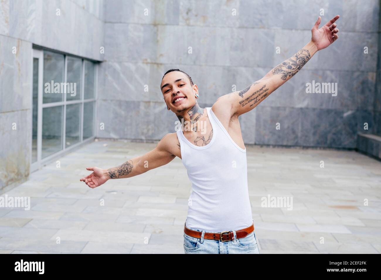 Young man tattooed arms hi-res stock photography and images - Alamy