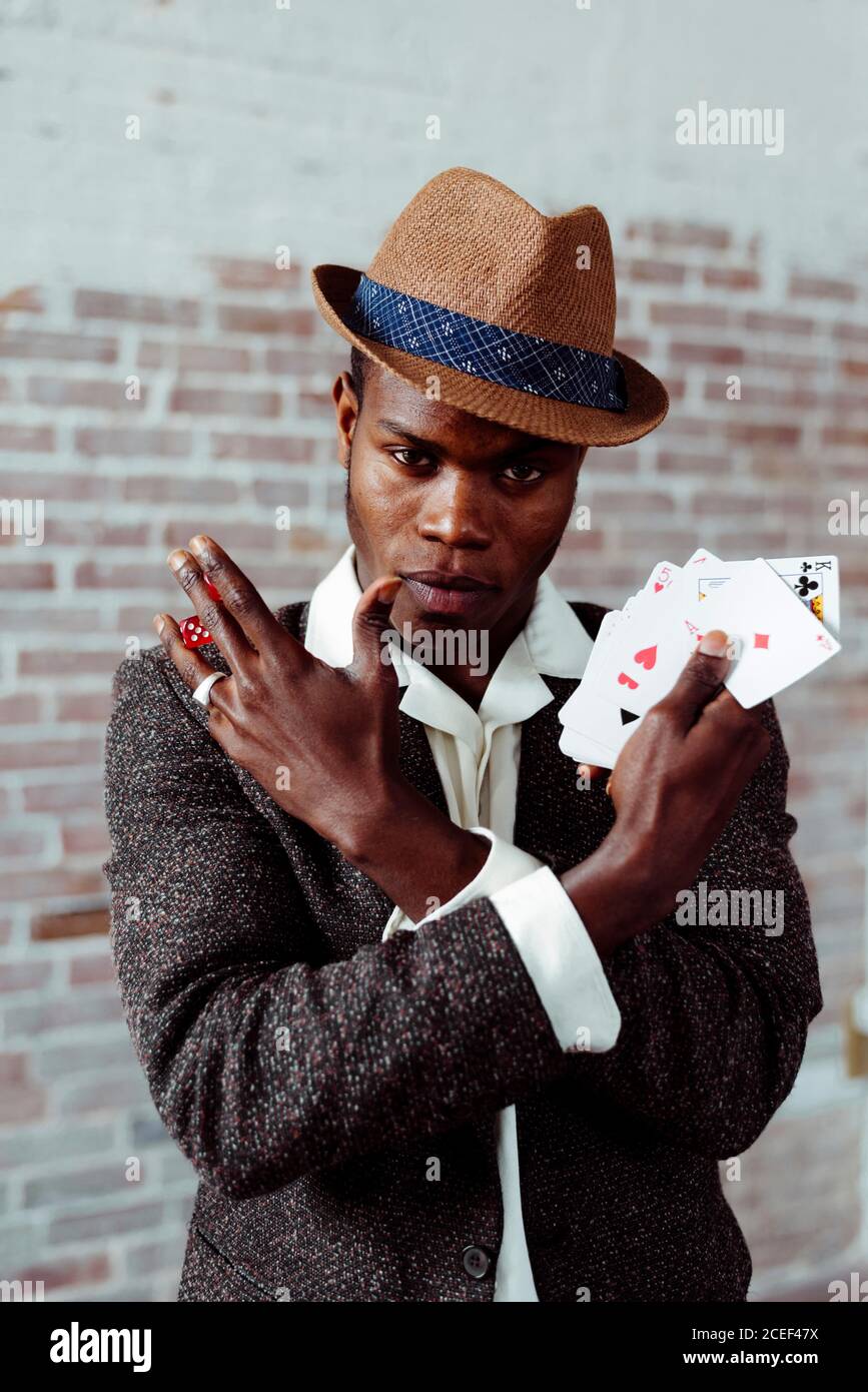 Young man throwing playing cards hi-res stock photography and images ...