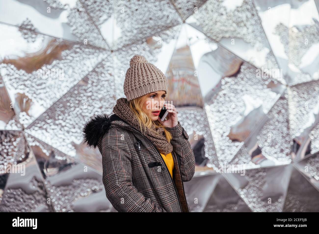 Young girl talking on the phone in the street Stock Photo - Alamy