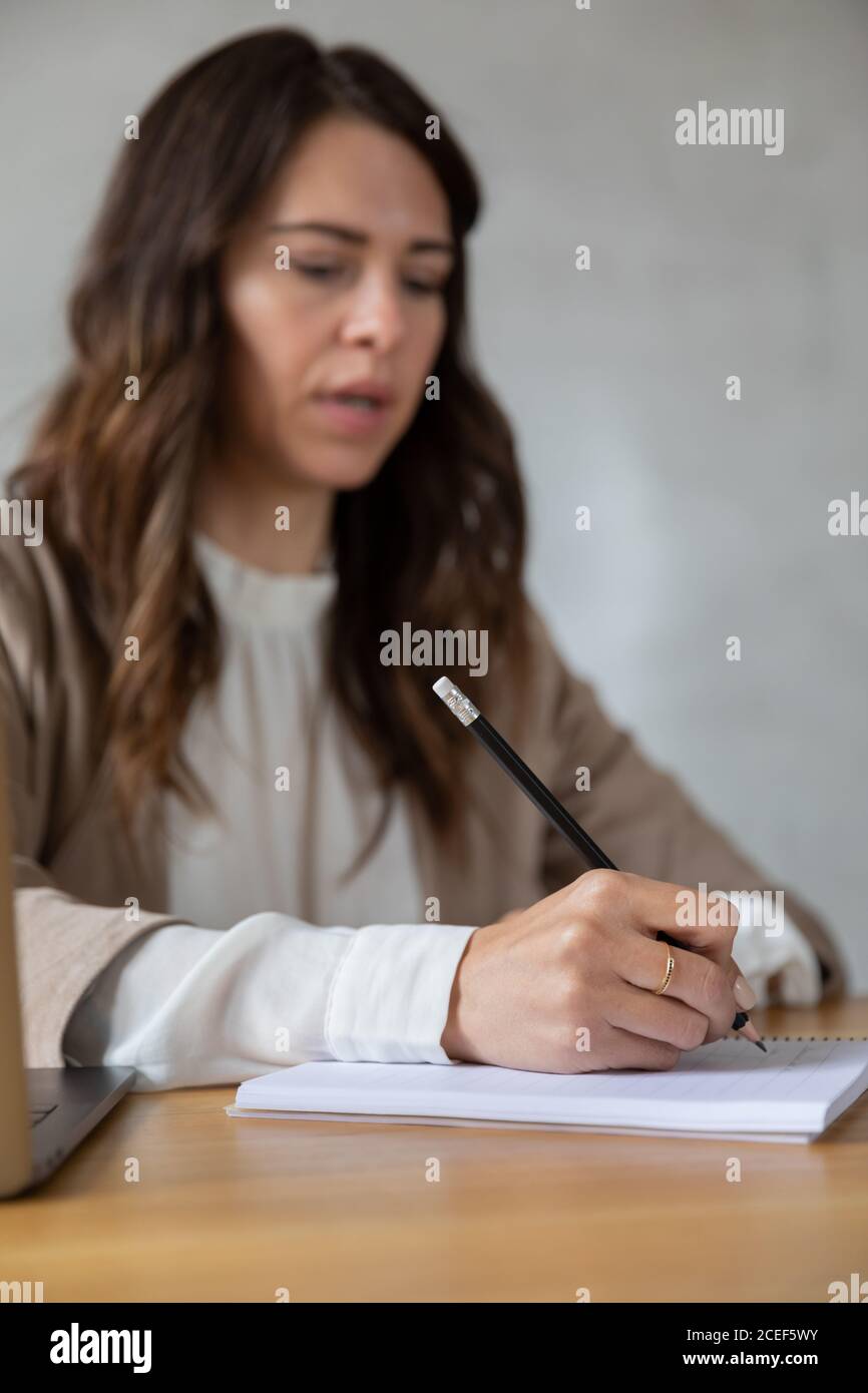 Young Woman writing her ideas in a notebook Stock Photo - Alamy