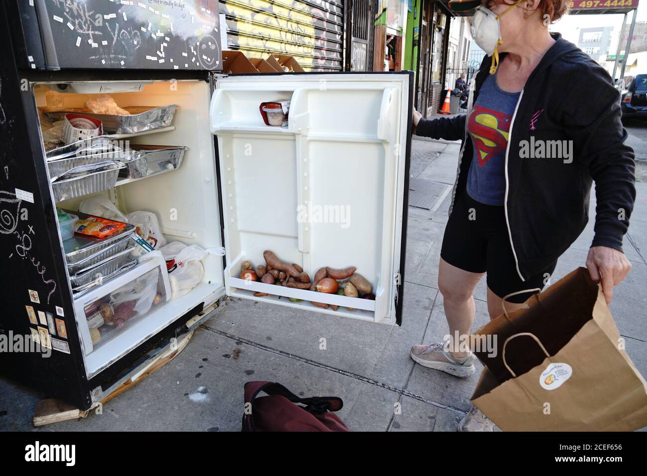Stocking up fridge hi-res stock photography and images - Alamy