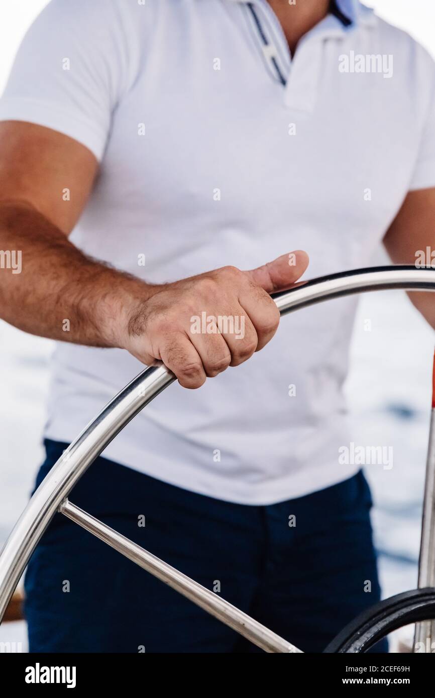 Captain of a ship sailing on a sailboat Stock Photo - Alamy
