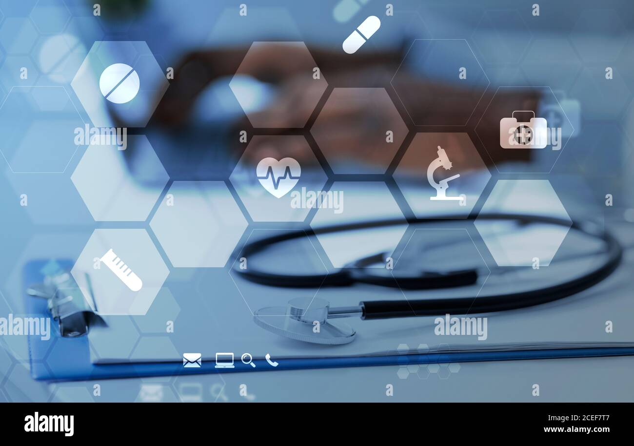 Healthcare and medical icons over stethoscope on medical chart Stock ...