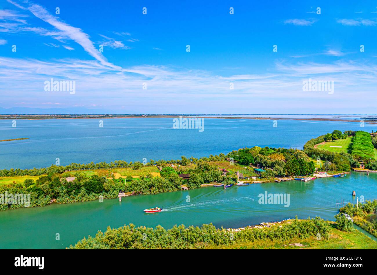 Aerial view of Torcello islands, water canal with fishing motor boats ...