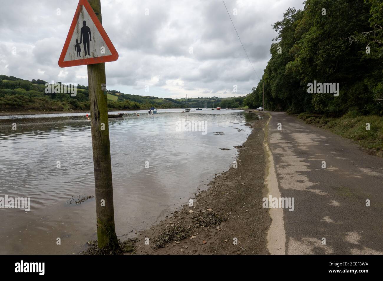 Pedestrian warning sign, Tidal Road, Aveton Gifford Stock Photo - Alamy