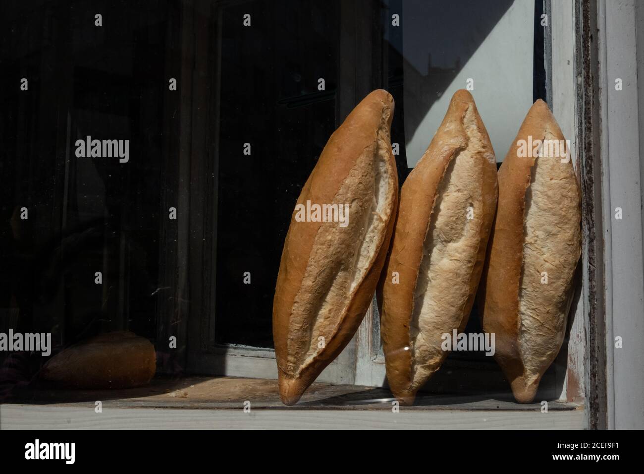 loaves of bread standing in a bakery window Stock Photo - Alamy