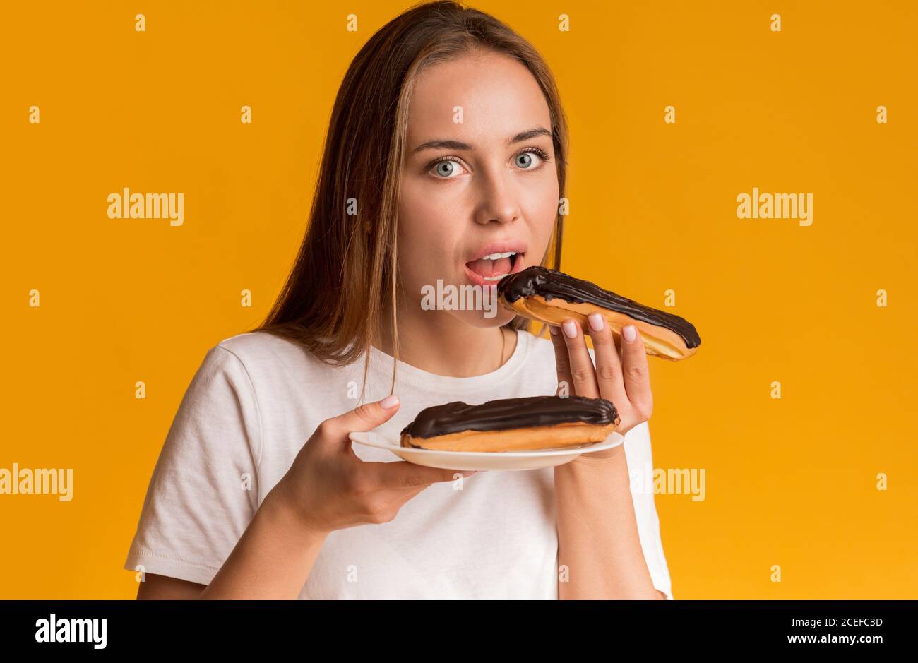 Millennial Girl Enjoying Chocolate Eclairs, Eating Unhealthy Sweets ...