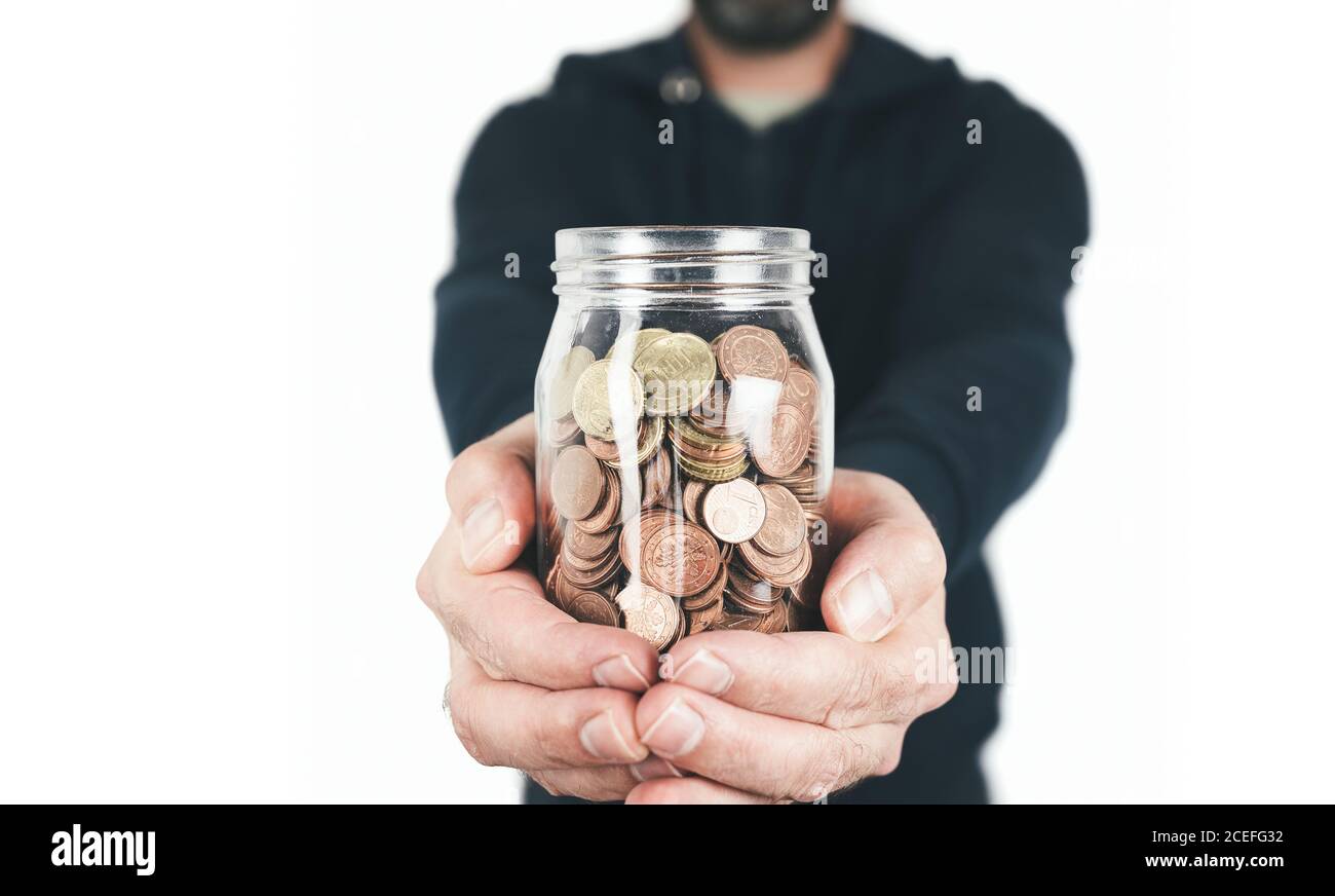 Hands holding coins hi-res stock photography and images - Alamy