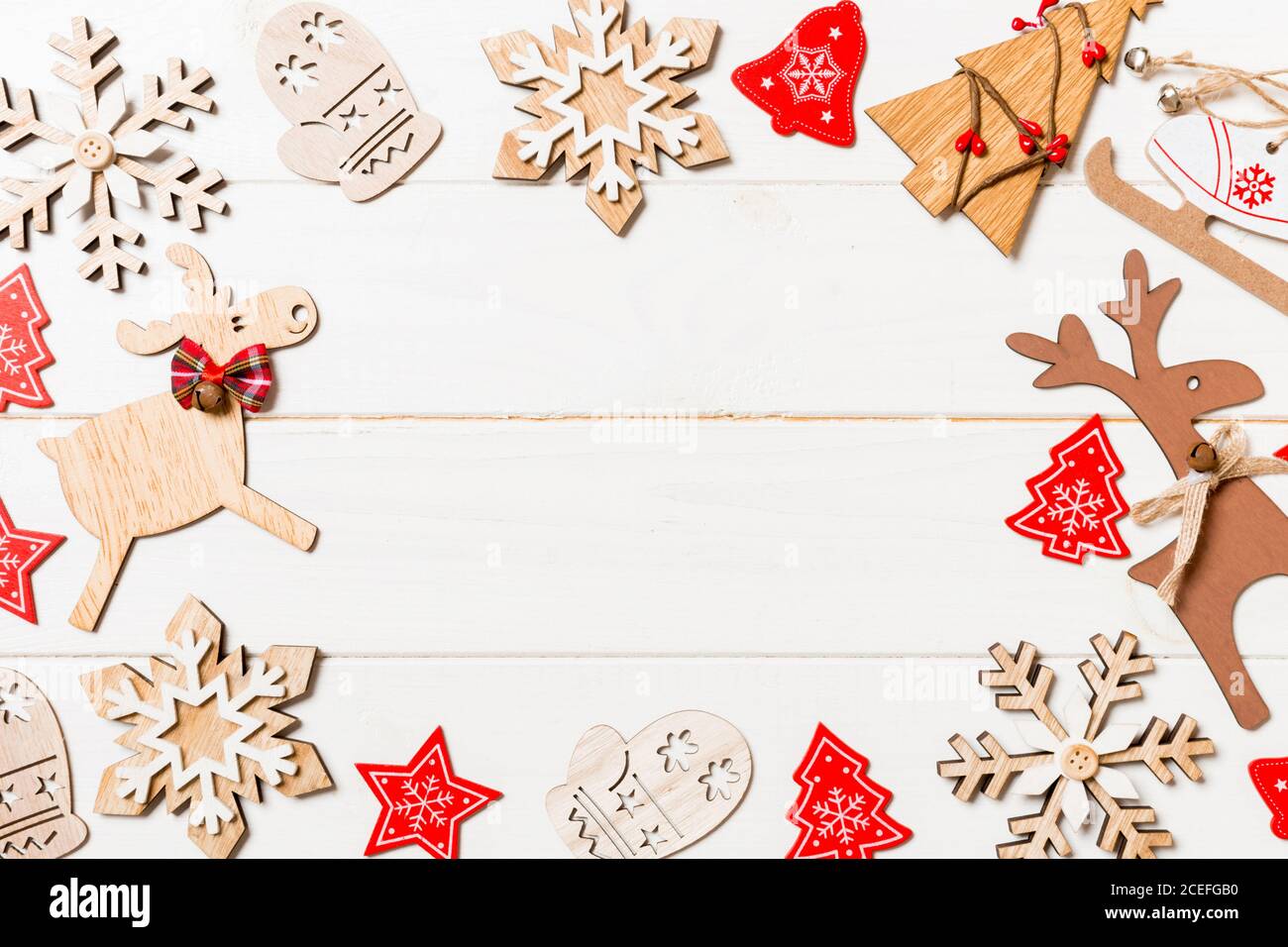 Top view of Christmas decorations and toys on wooden background. Copy ...