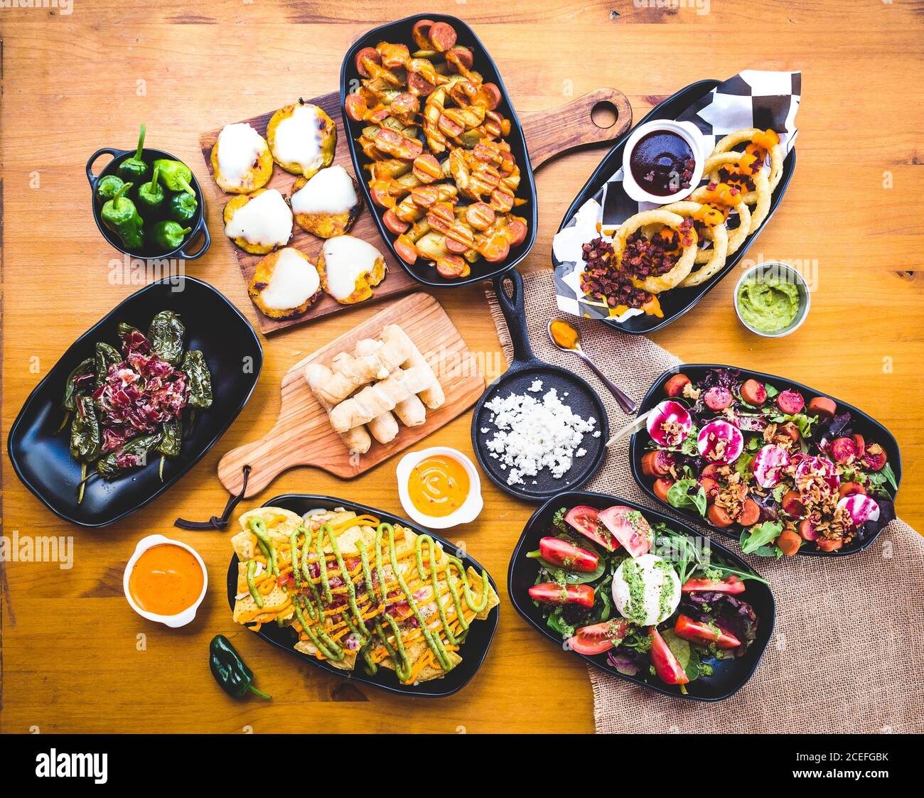 Close-up of plate with nacho chips in dressing served with various ...