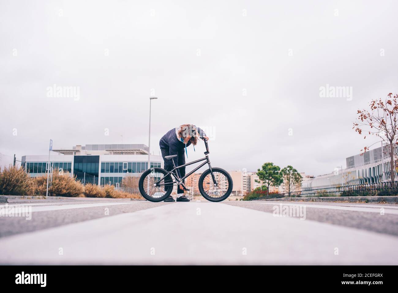Young man poses with BMX bicycle Stock Photo - Alamy