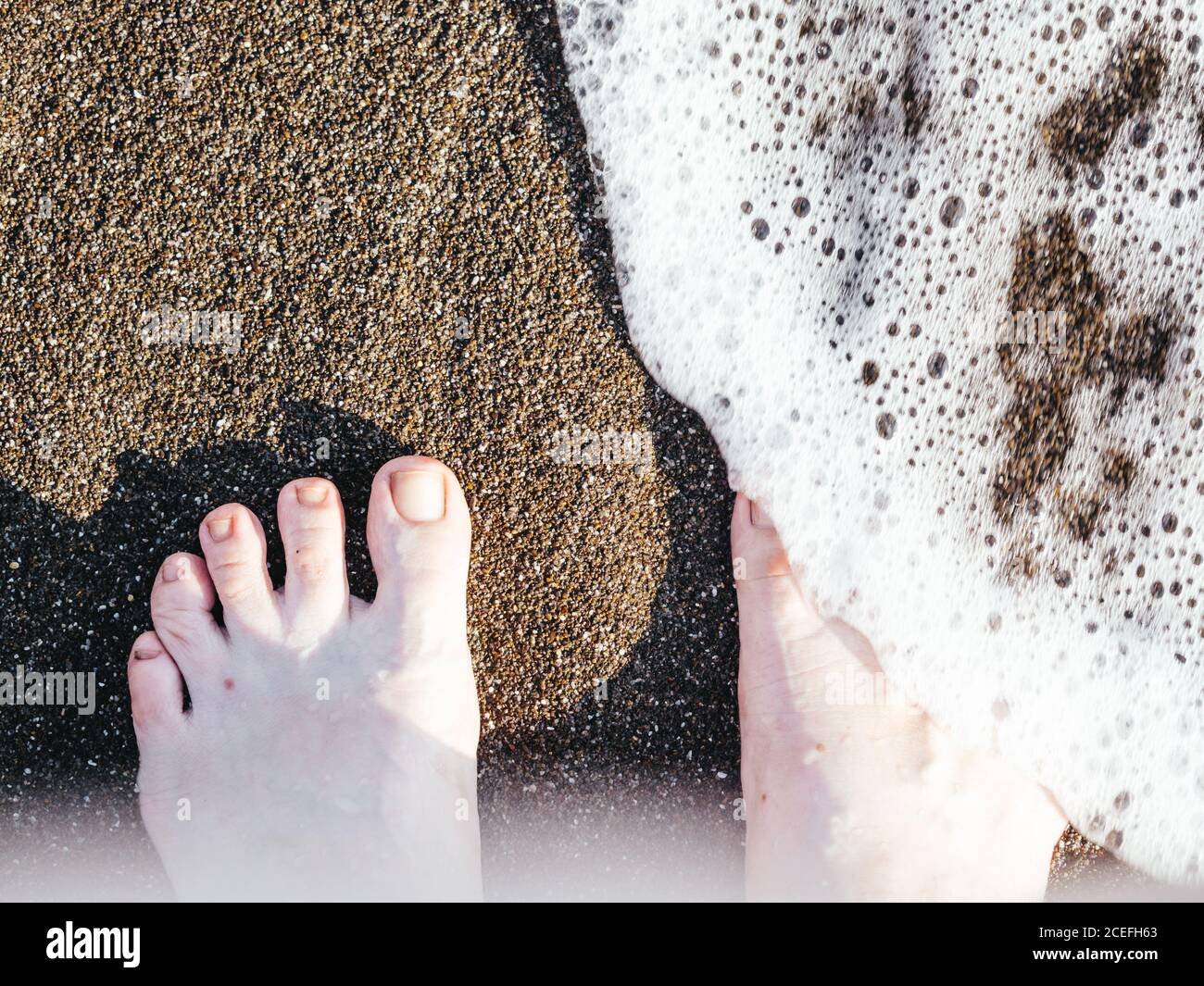 Woman toes sand hi-res stock photography and images - Alamy