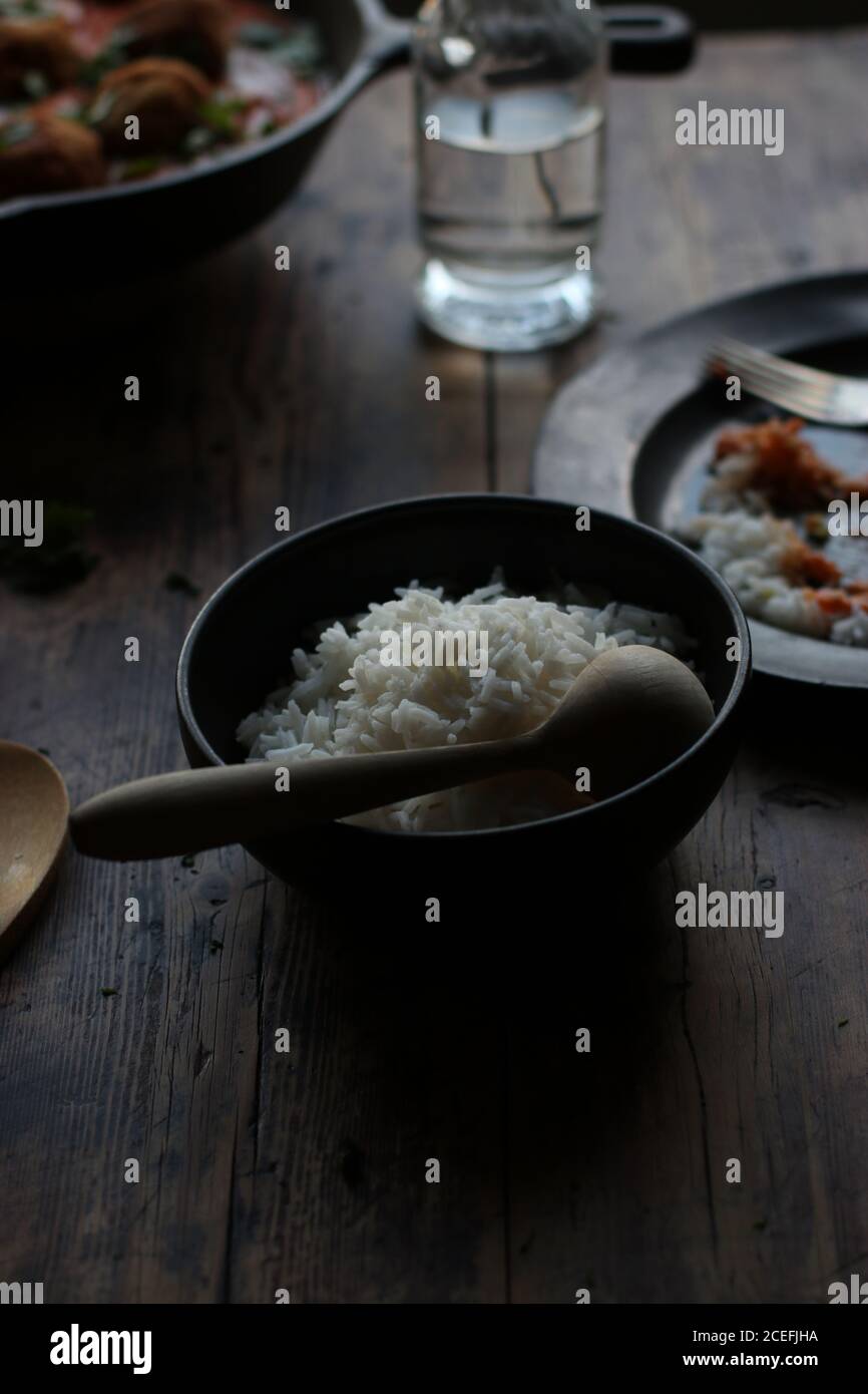 Bottle of water near rice and empty plate Stock Photo - Alamy