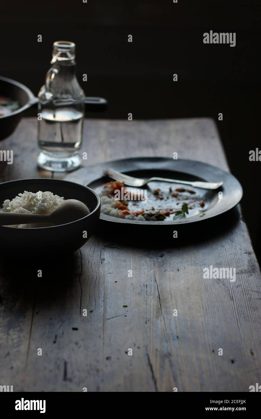 Bottle of water near rice and empty plate Stock Photo - Alamy
