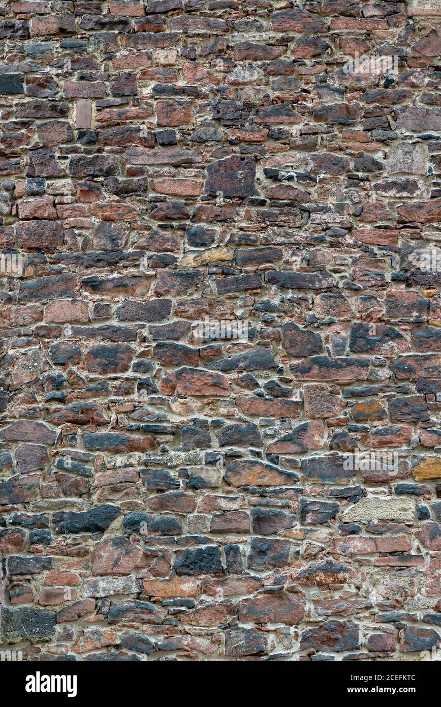 "vertical view of colorful sandstone massive stone wall background ...
