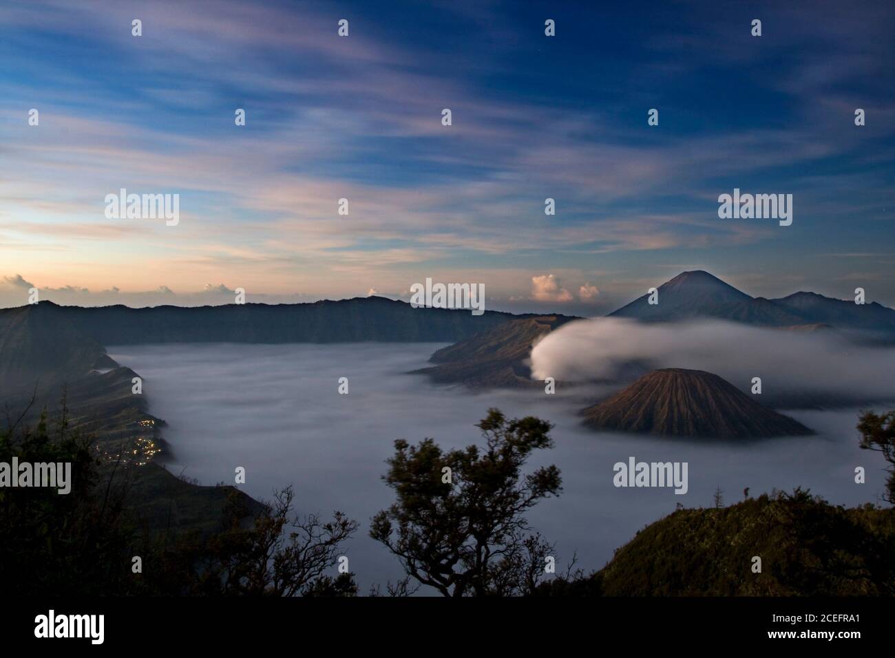 From above view of volcanoes in dense mist on beautiful sky background ...