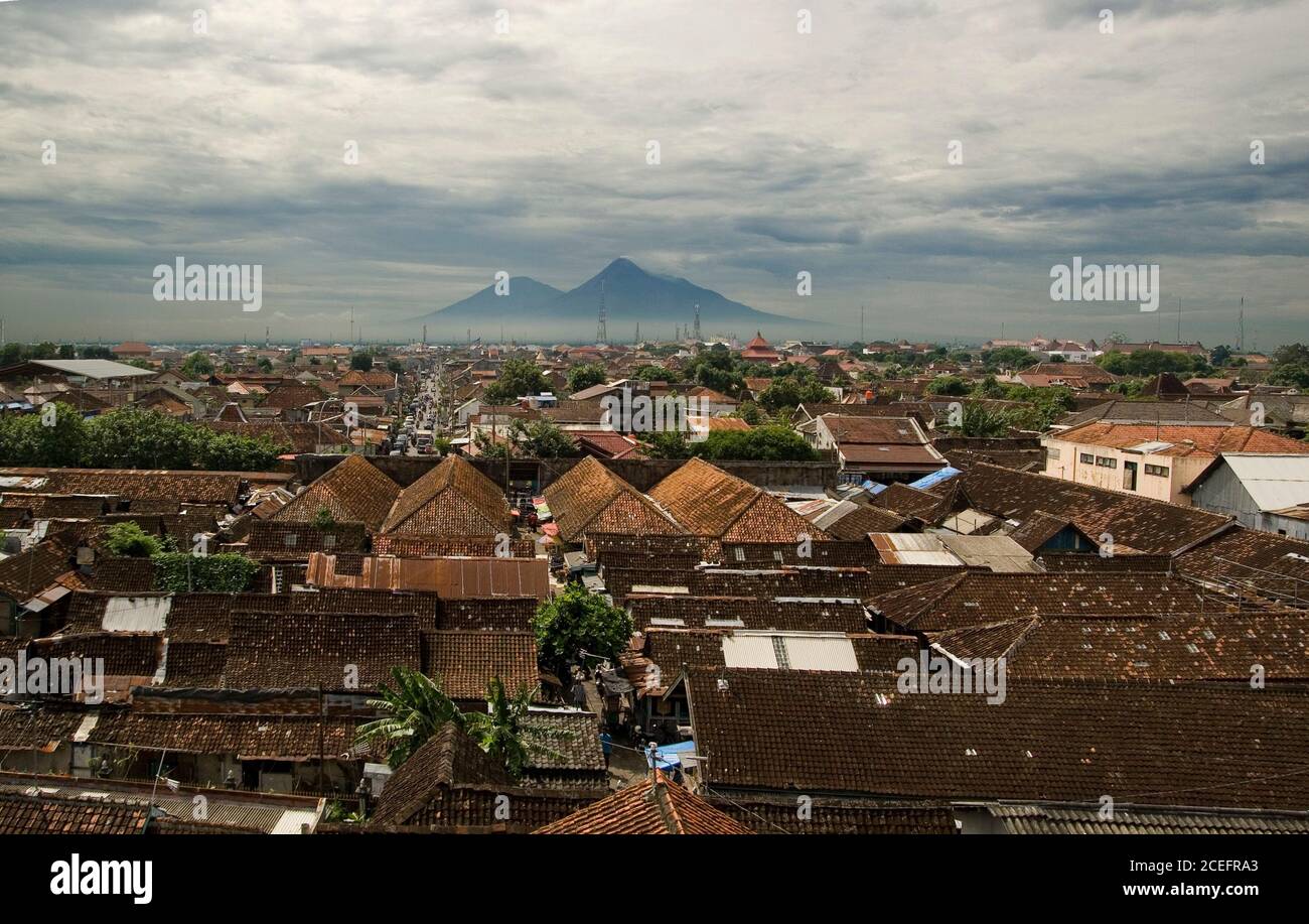 From above view of town's roofs built at foot of volcano in cheerless ...