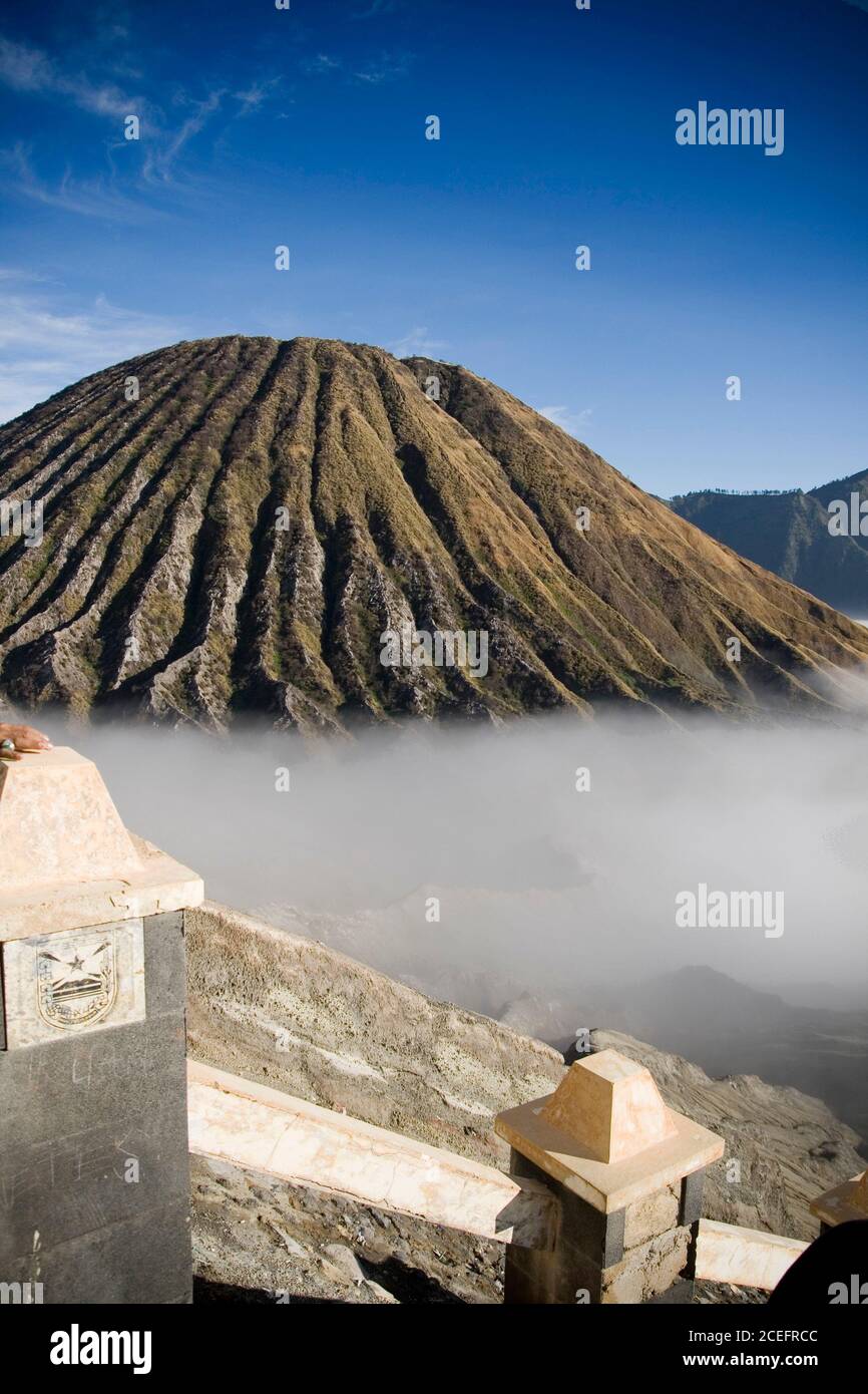 From above view of volcanoes in dense mist on beautiful sky background ...