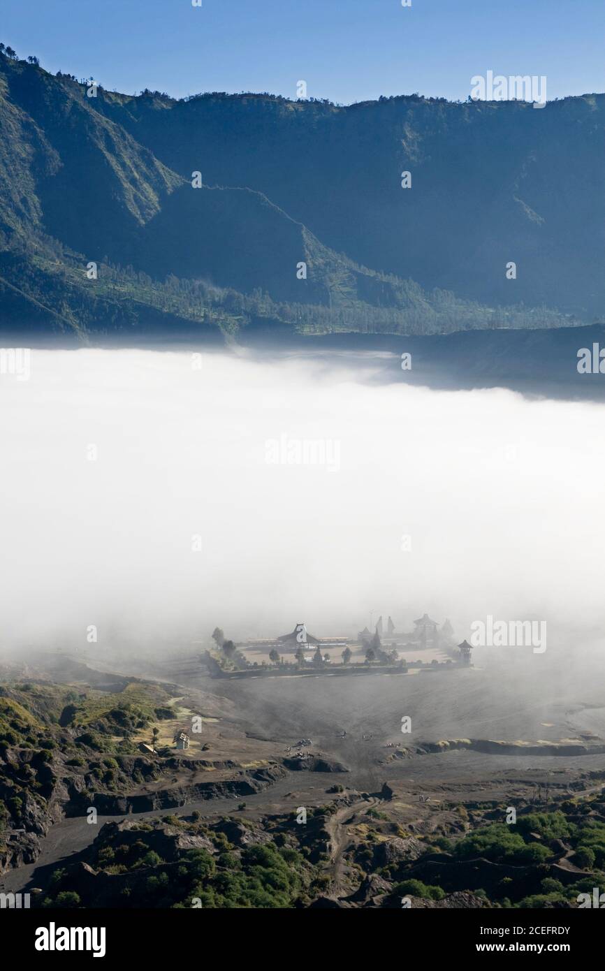 From above view of volcanoes in dense mist on beautiful sky background ...