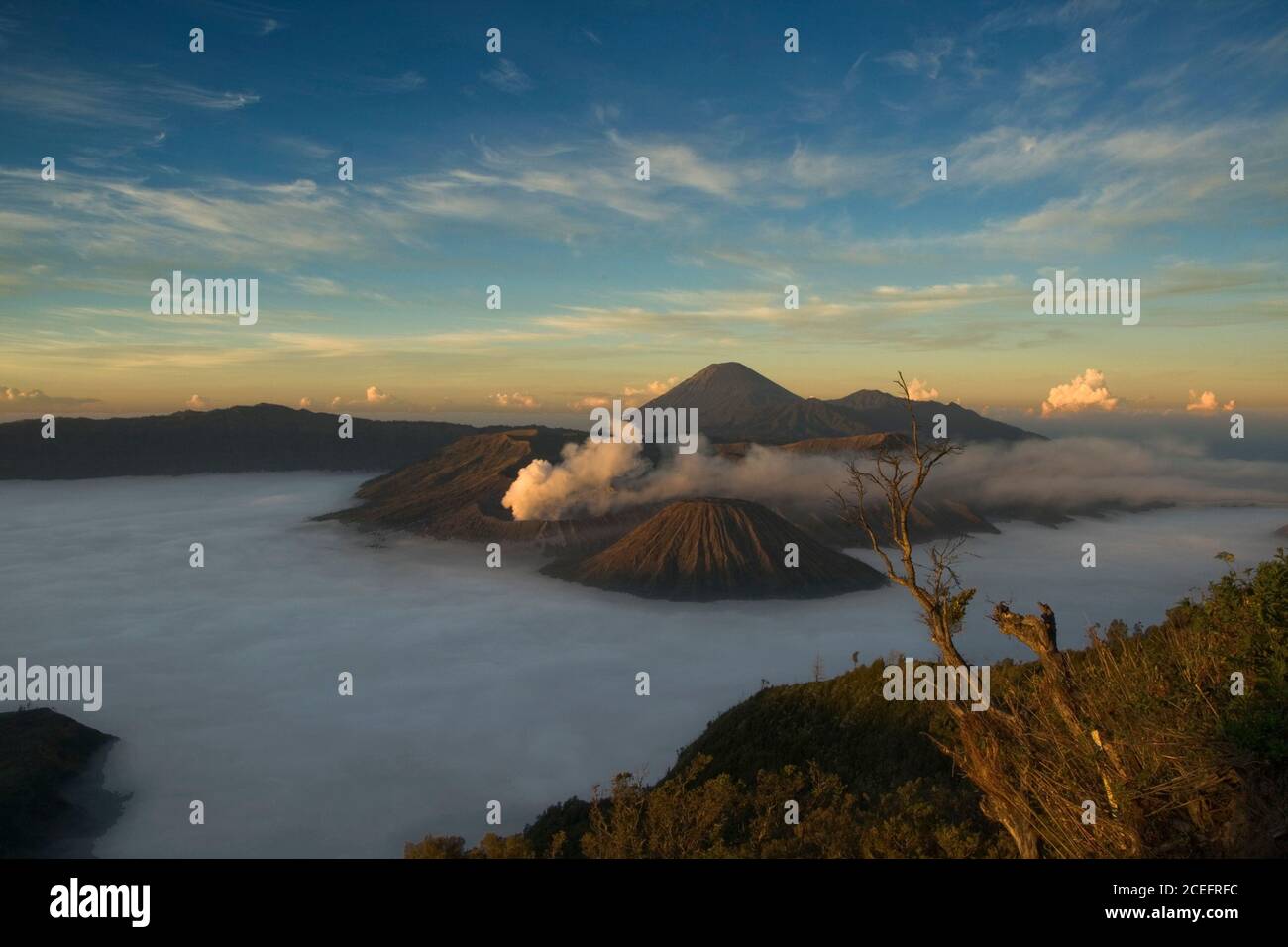 From above view of volcanoes in dense mist on beautiful sky background ...