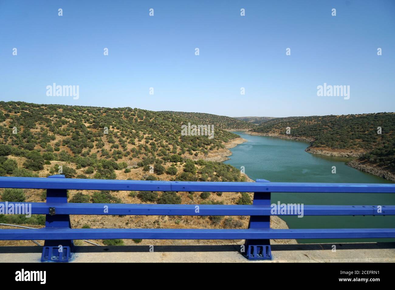 Beautiful shot of blue metal railings bridge over a river Stock Photo ...