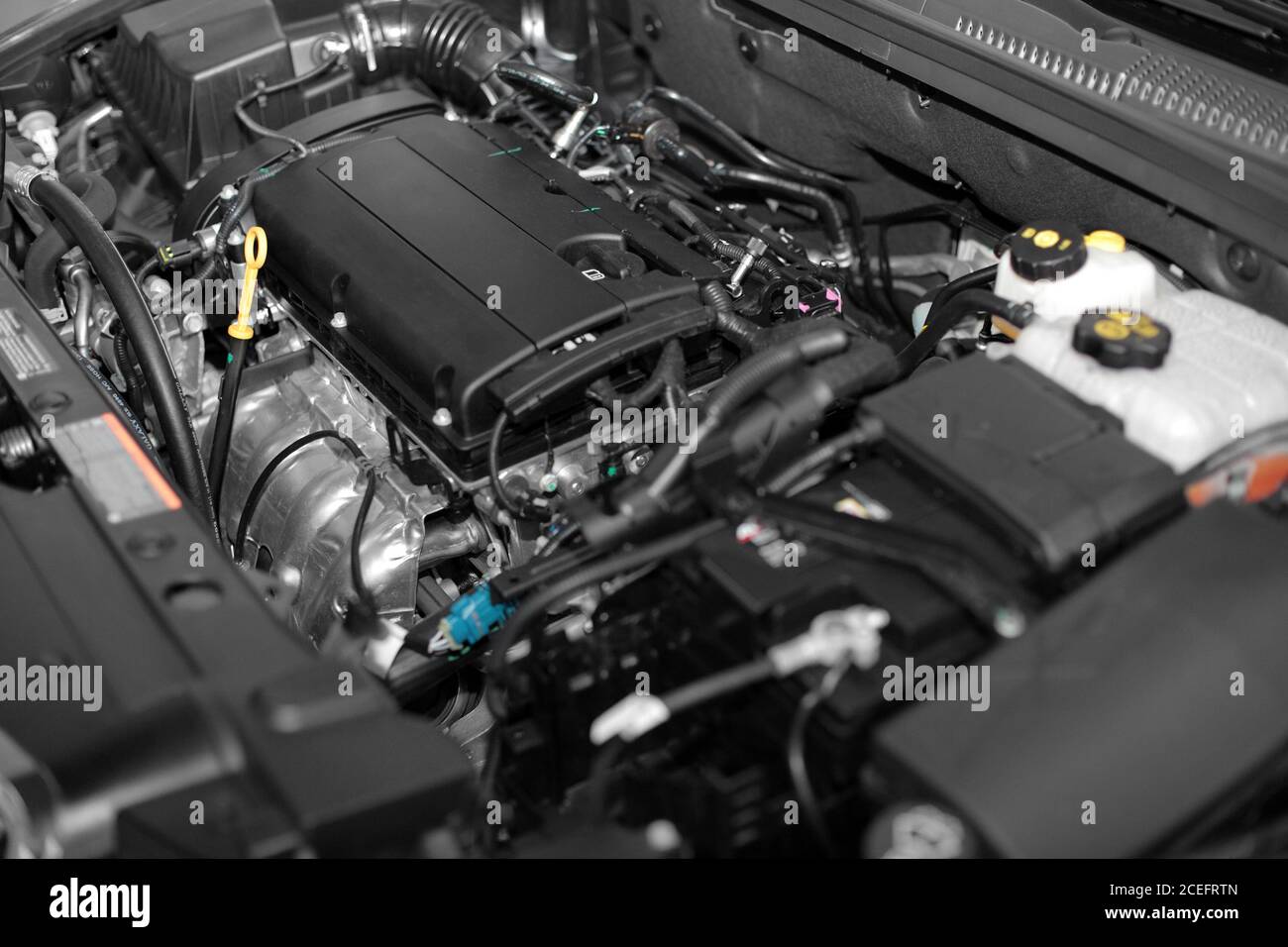 Details of the car engine in the open hood Stock Photo - Alamy