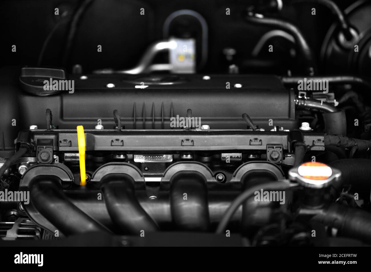 Details of the car engine in the open hood Stock Photo - Alamy