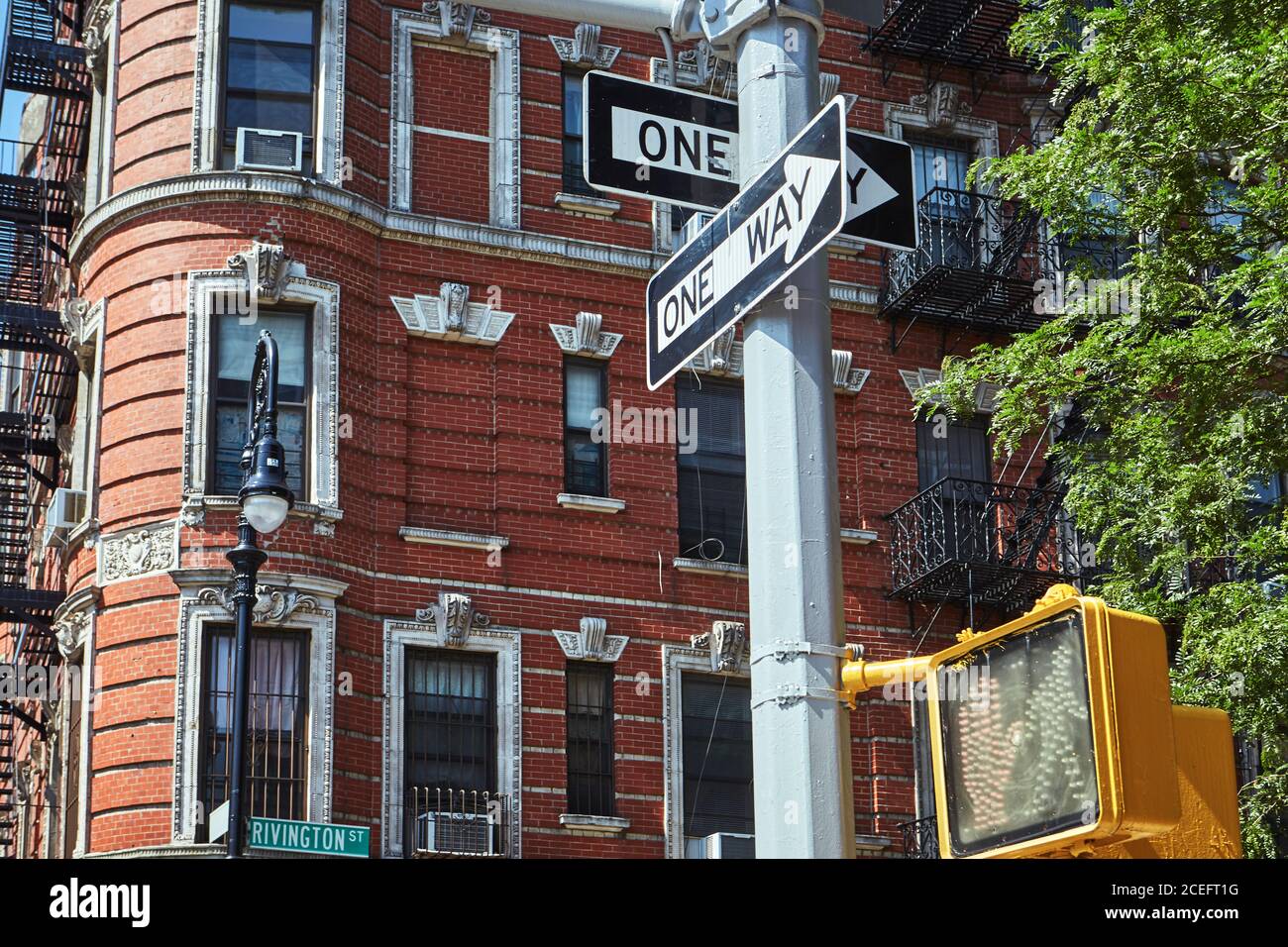 Nice signpost and modern traffic light standing on street in uptown of ...