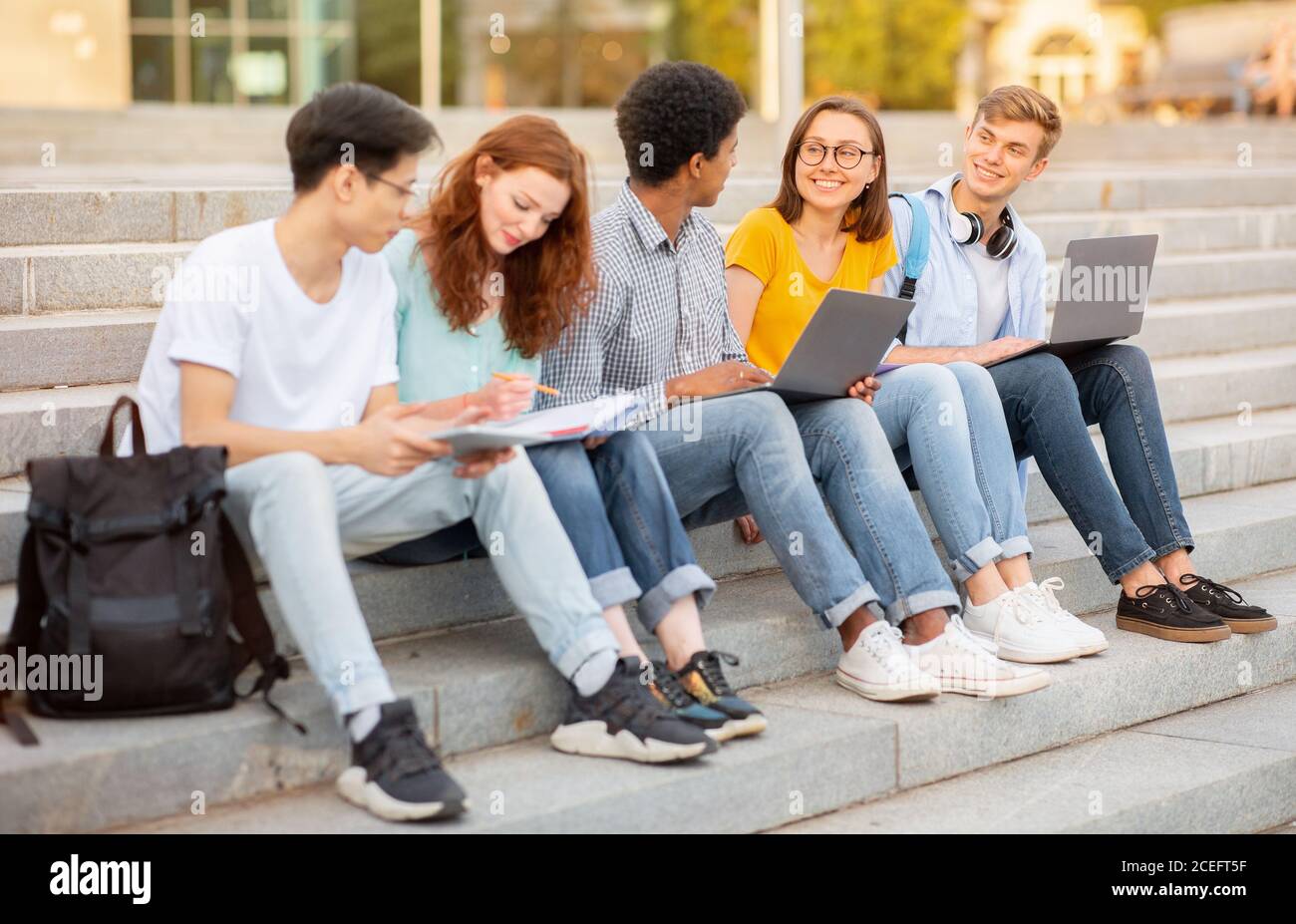 Girls sitting outside school hi-res stock photography and images - Alamy