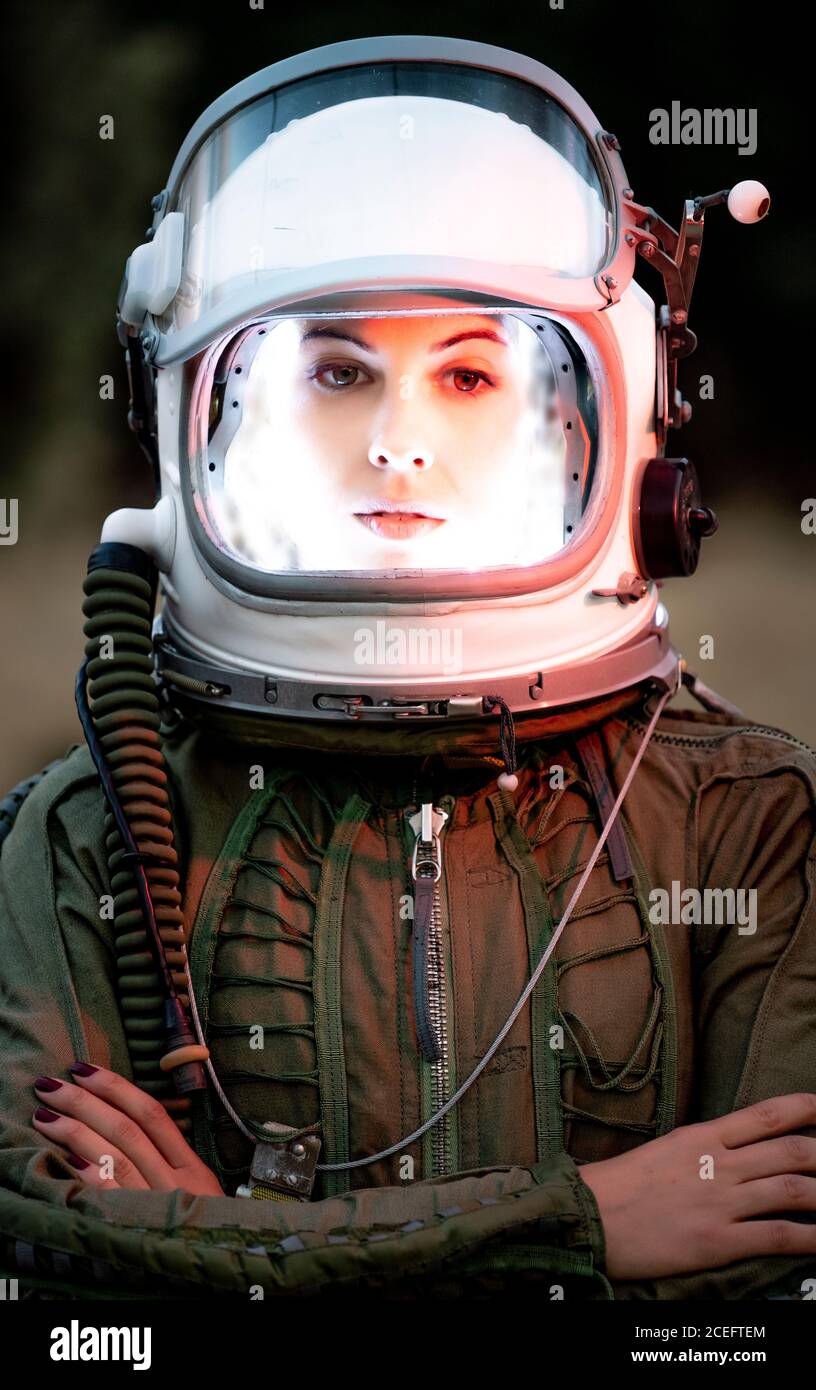 Beautiful Woman poses looking at camera dressed as an astronaut Stock ...