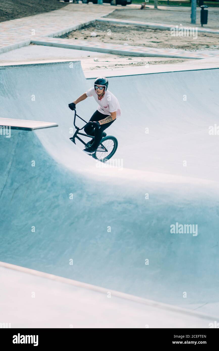 man riding bicycle on springboard Stock Photo - Alamy