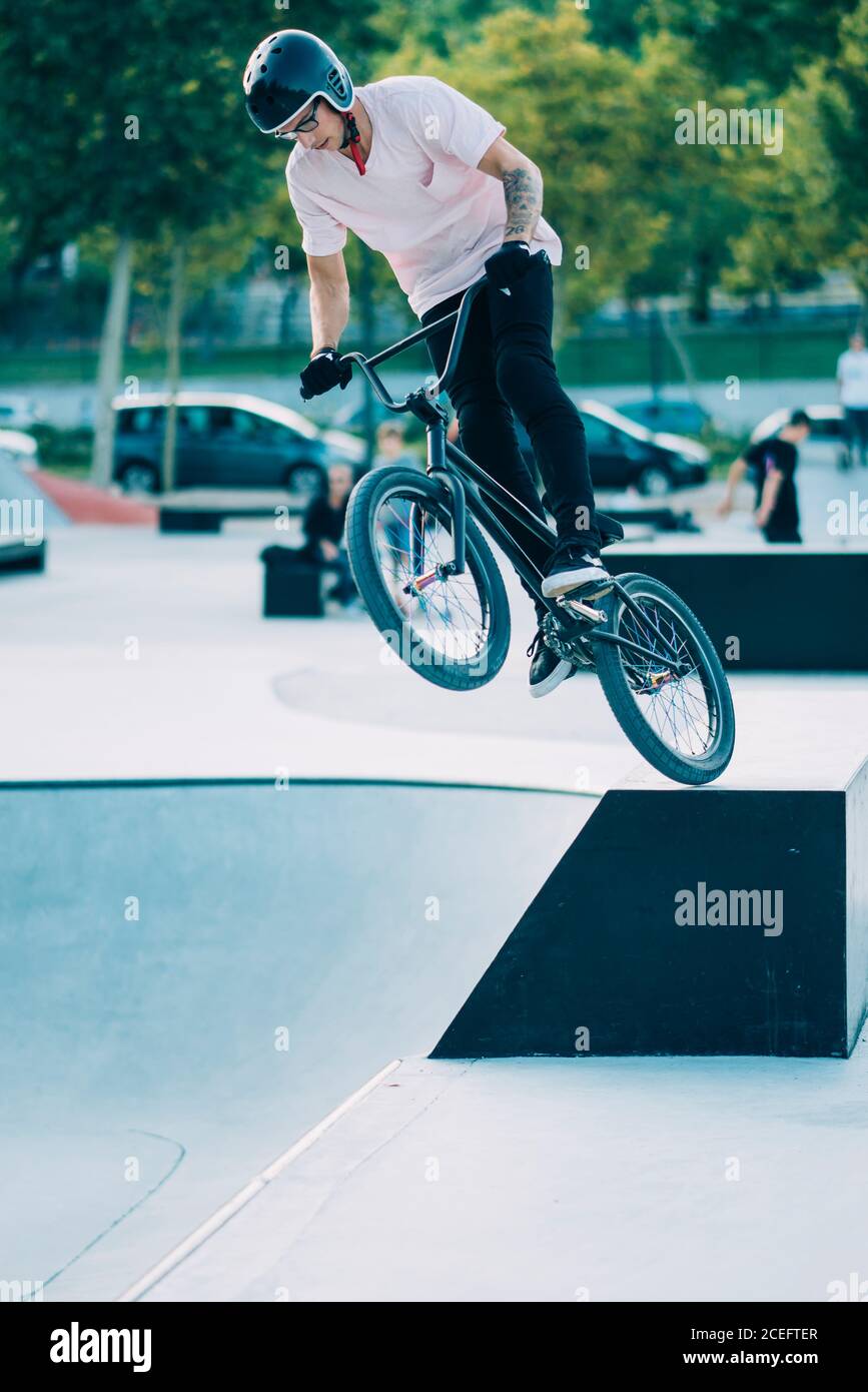 man riding bicycle on springboard Stock Photo - Alamy