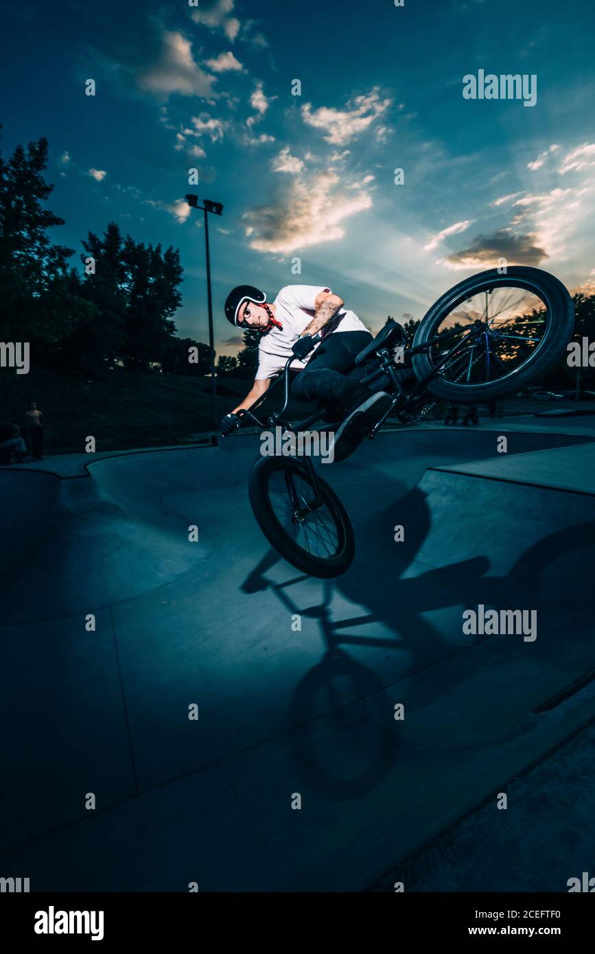man riding bicycle on springboard Stock Photo - Alamy