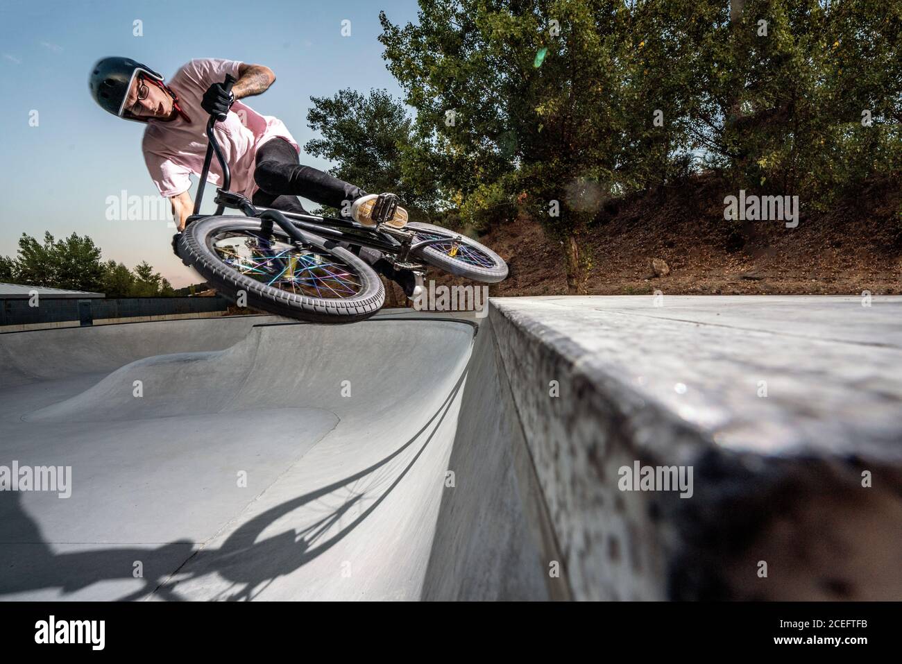 man riding bicycle on springboard Stock Photo - Alamy