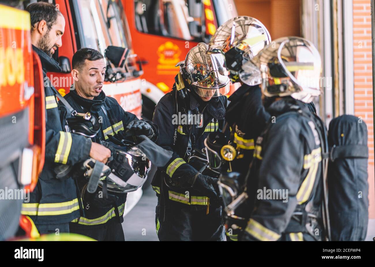 Firemen working at fire station Stock Photo - Alamy