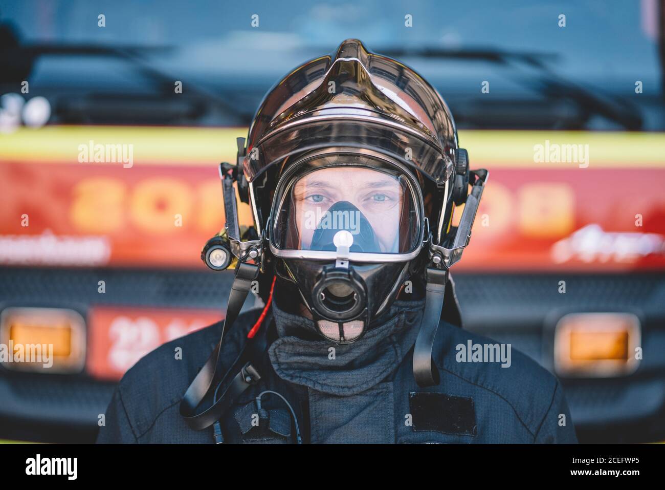 Firefighter with helmet hi-res stock photography and images - Alamy