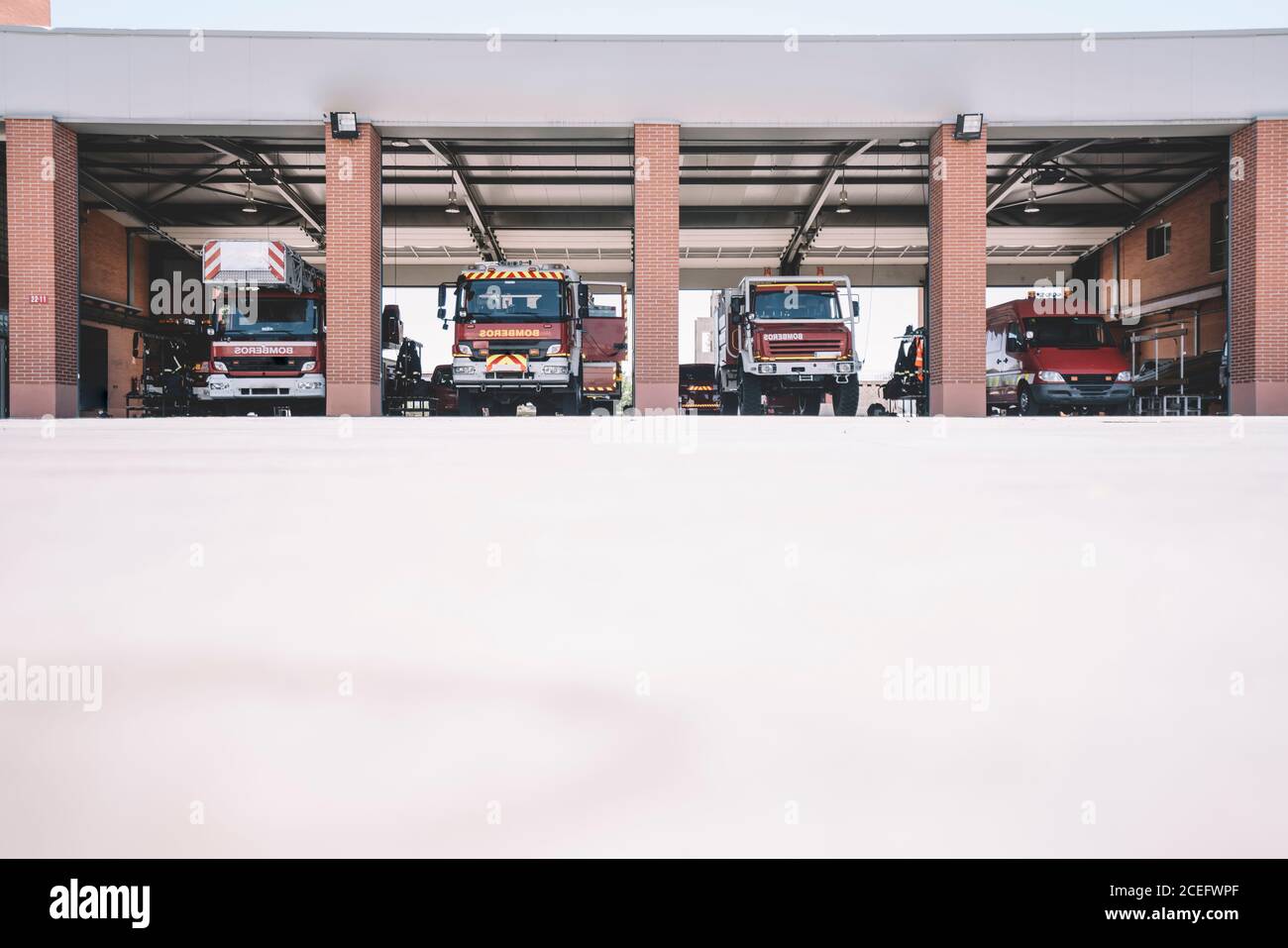 Fire station with parked vehicles Stock Photo - Alamy