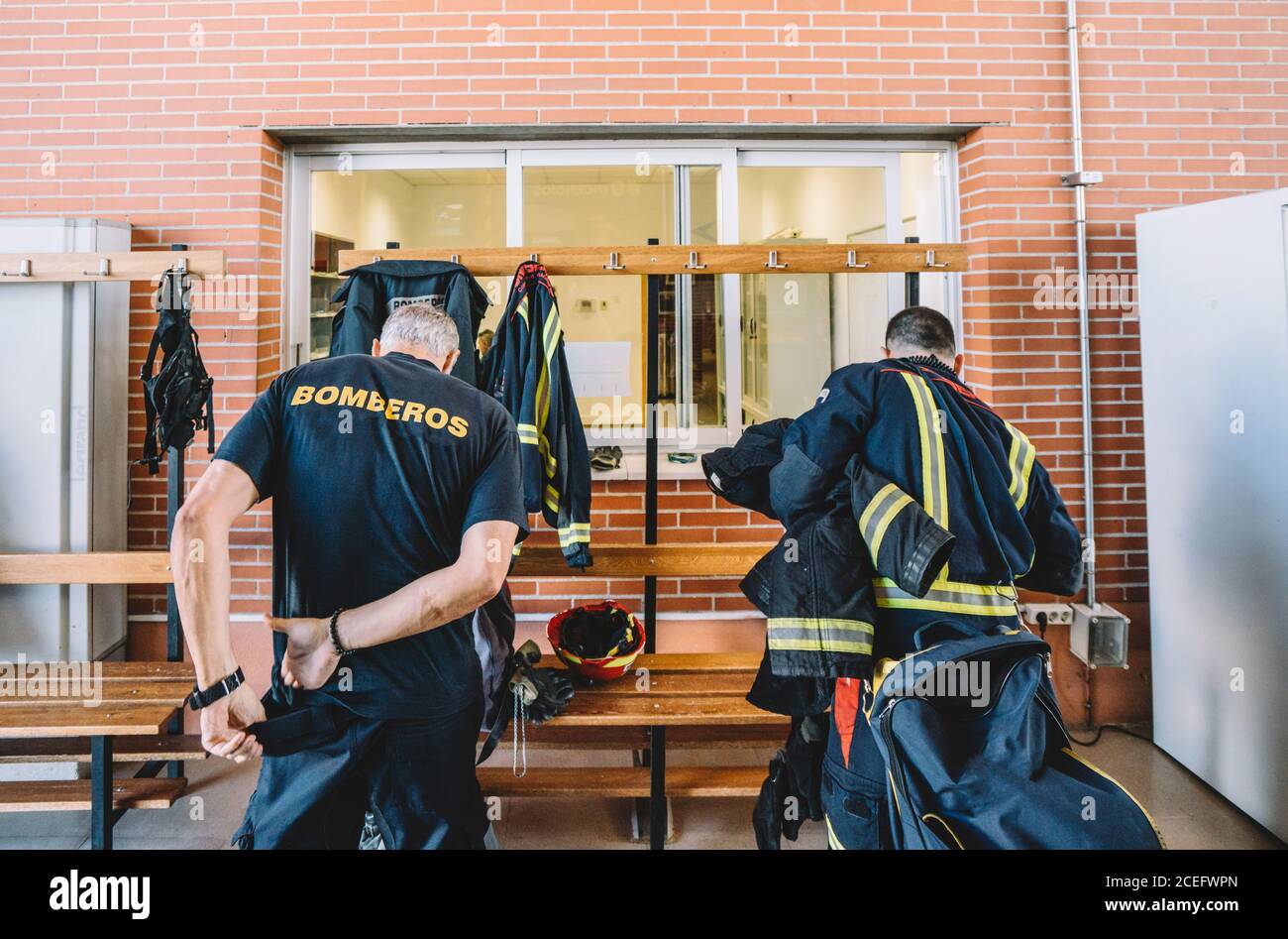 Firemen working at fire station Stock Photo - Alamy