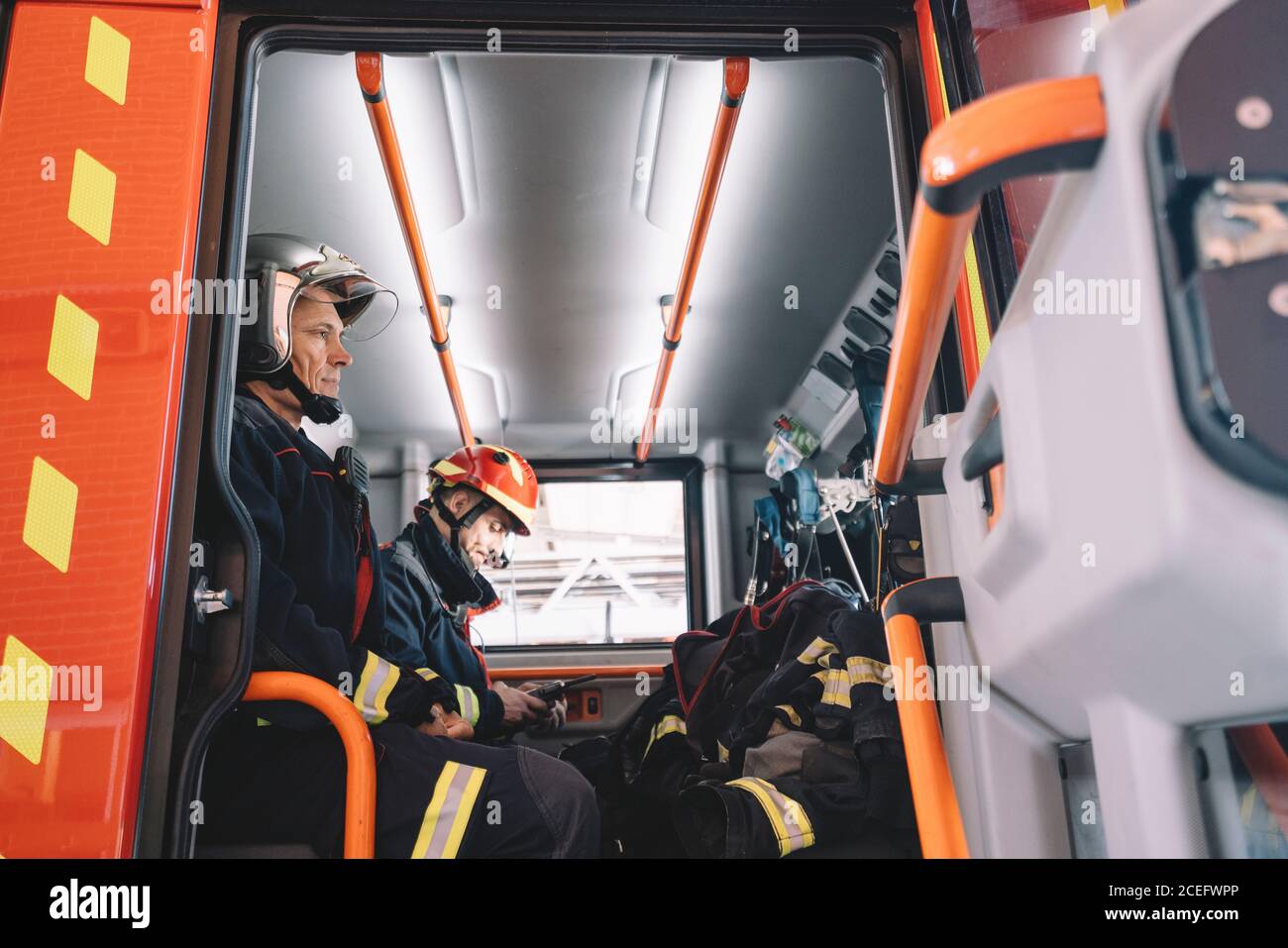 Firemen working inside an emergency vehicle Stock Photo - Alamy