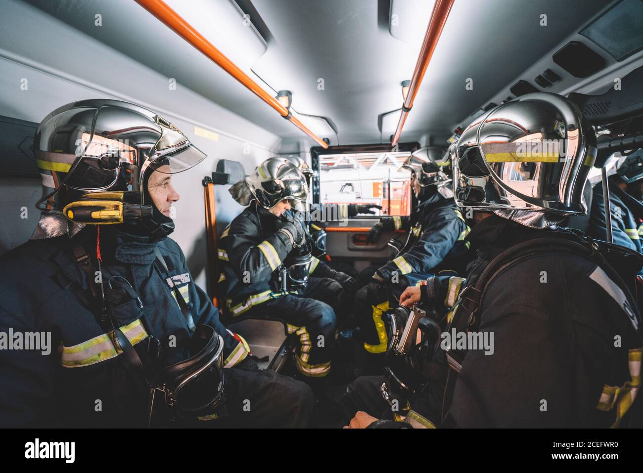 Firemen working inside an emergency vehicle Stock Photo - Alamy