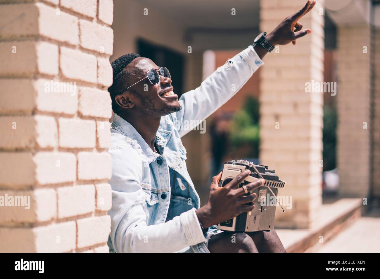 African man with vintage radio device Stock Photo - Alamy