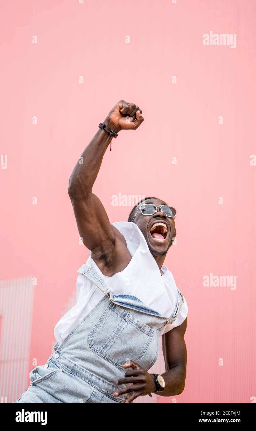 African man shouting victory clenched fist Stock Photo - Alamy