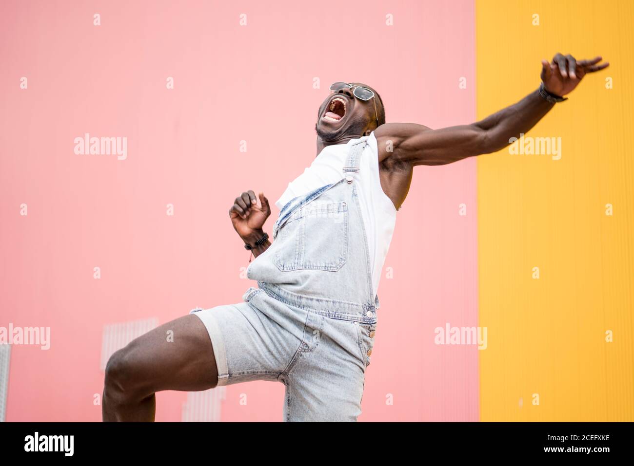 African man shouting victory clenched fist Stock Photo - Alamy