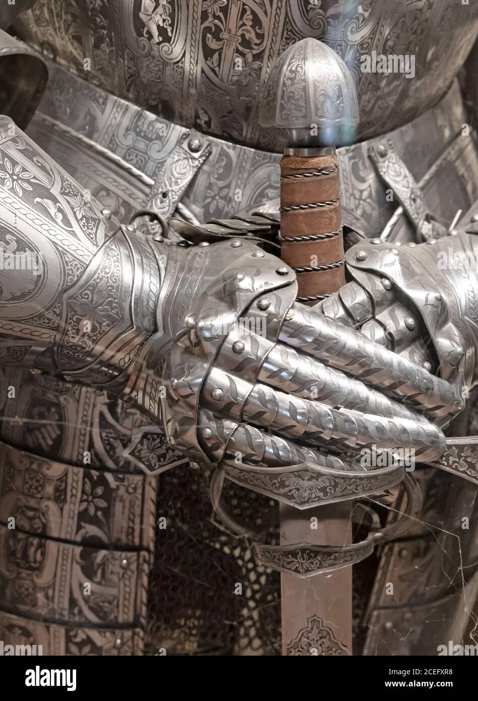 Traditional medieval knight with sword, closeup of the hands and sword ...