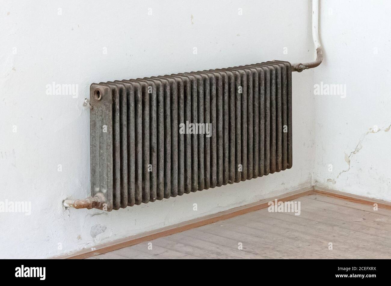 Old radiator in an empty historic home, heater Stock Photo - Alamy