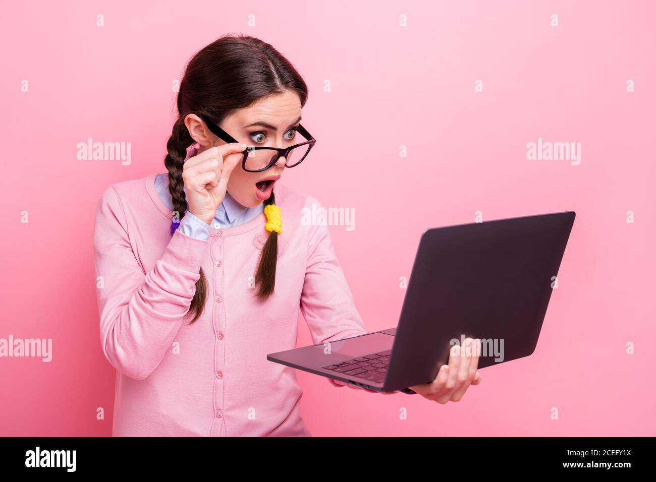 Photo of crazy shocked student lady hold computer notebook hands read ...