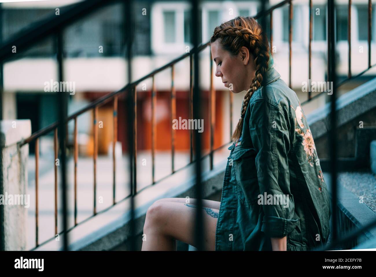 Pretty red-haired girl with braids. It is in the city of Madrid Spain ...